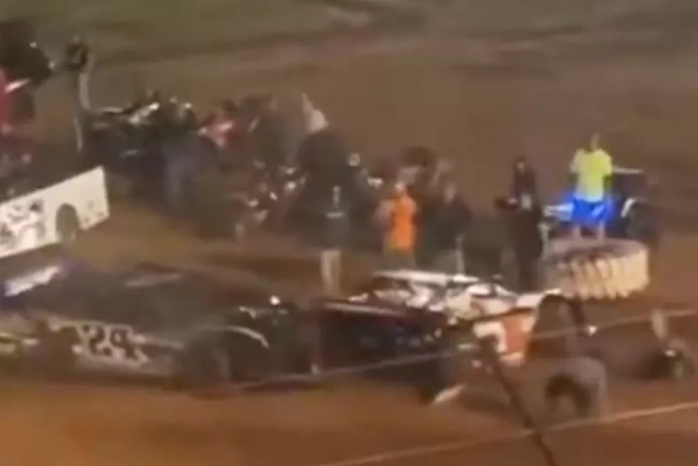 Driver arrested and banned after ramming car in the pits, knocking over ...