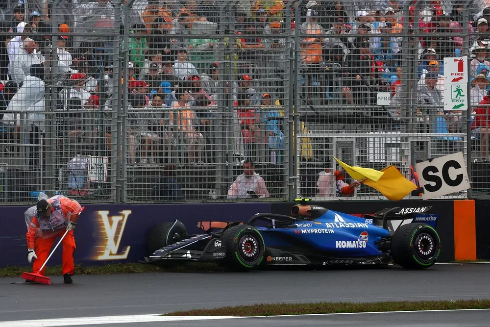 Carlos Sainz crashes in wet Australian GP start, blames "torque surge"